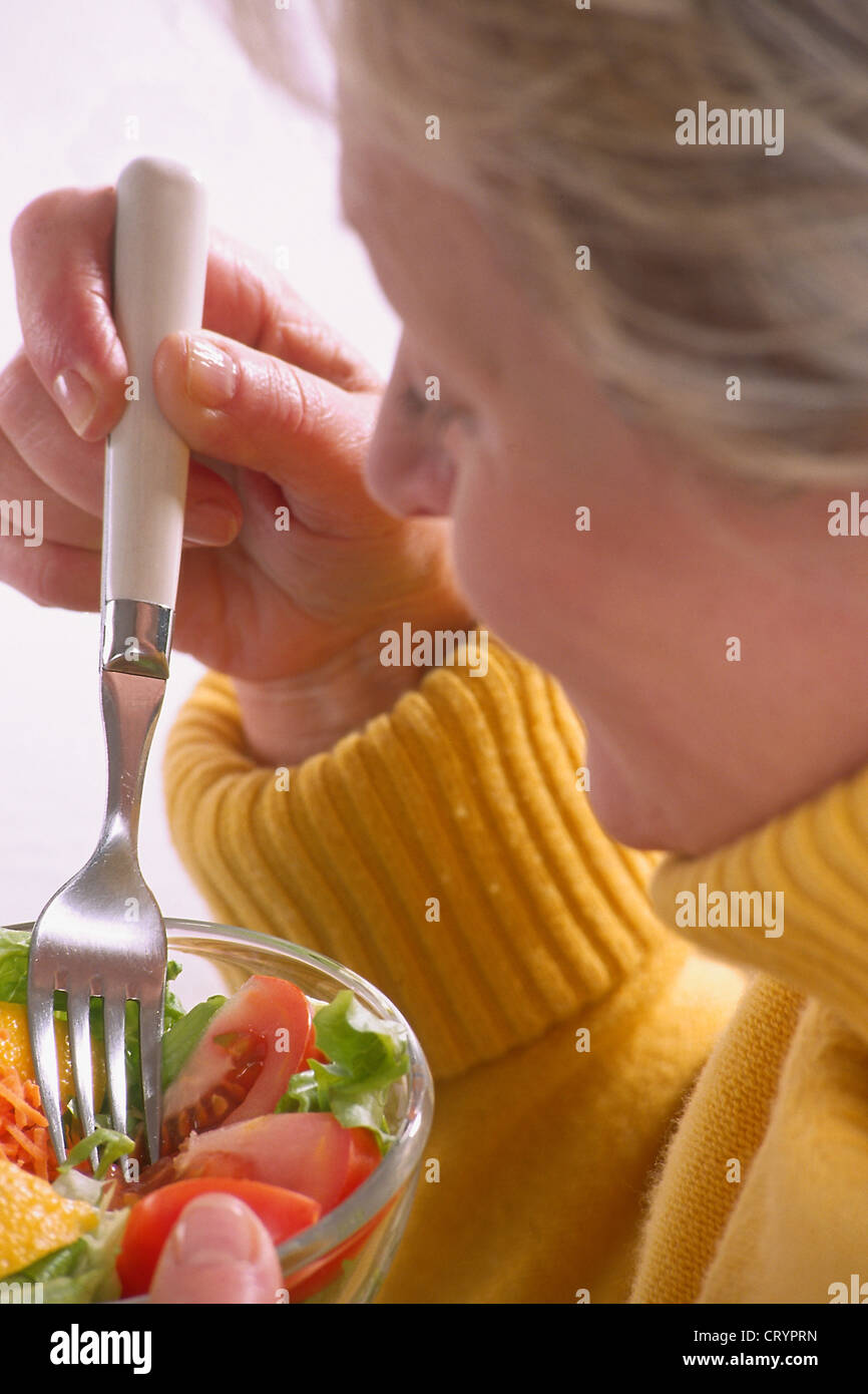 ELDERLY P. EATING RAW VEGETABLES Stock Photo - Alamy