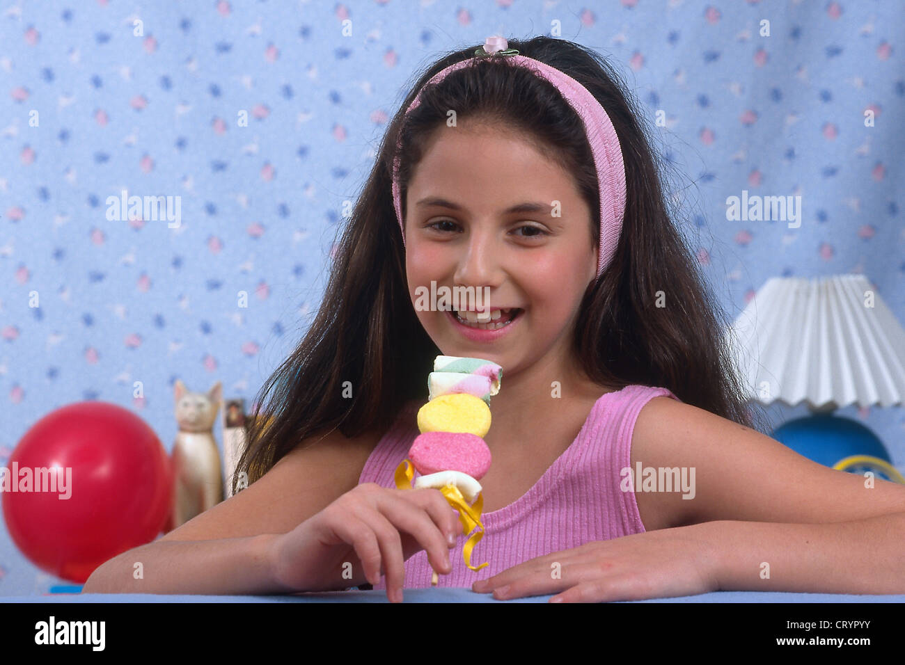 CHILD EATING SWEETS Stock Photo - Alamy