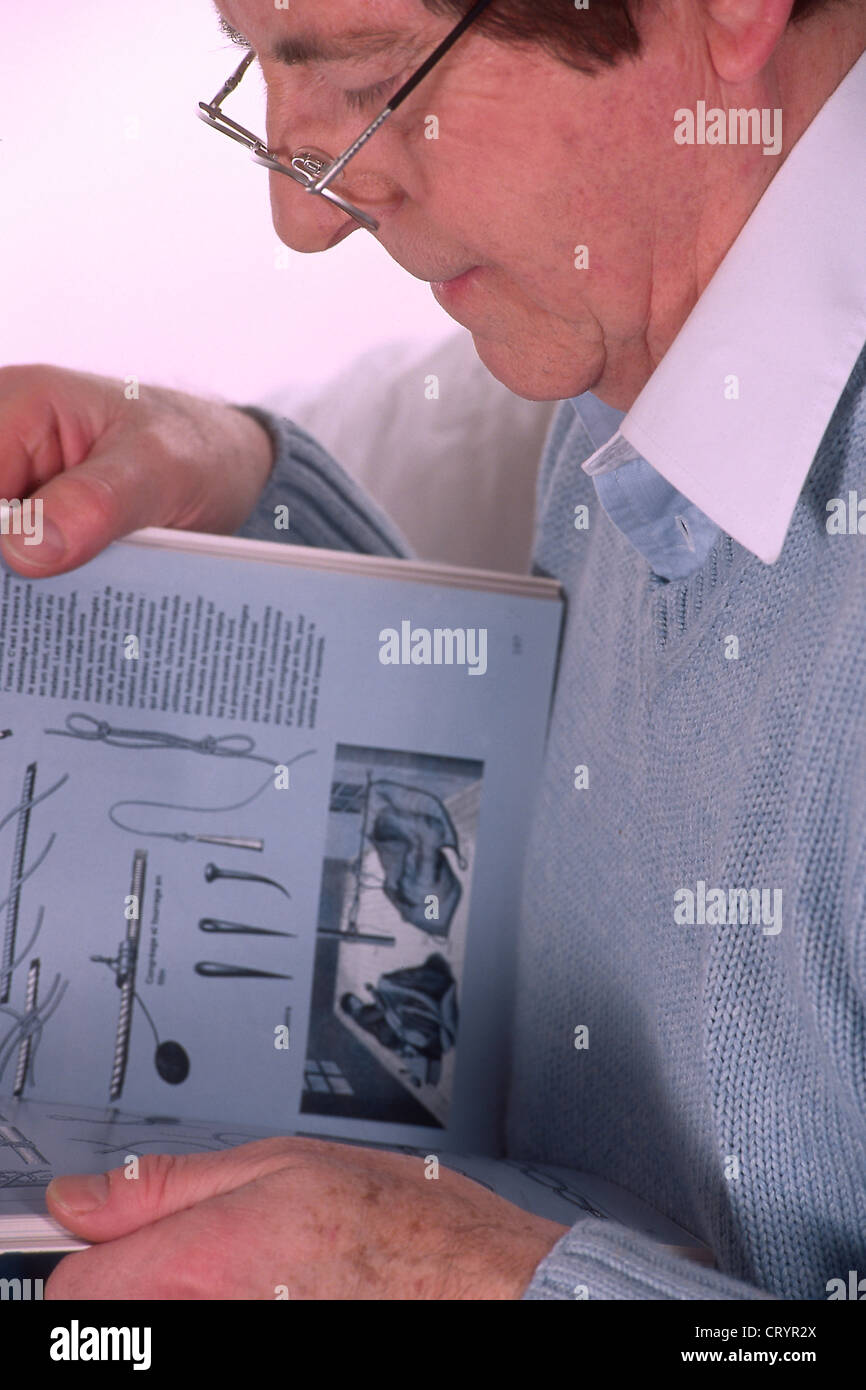 ELDERLY PERSON READING Stock Photo - Alamy