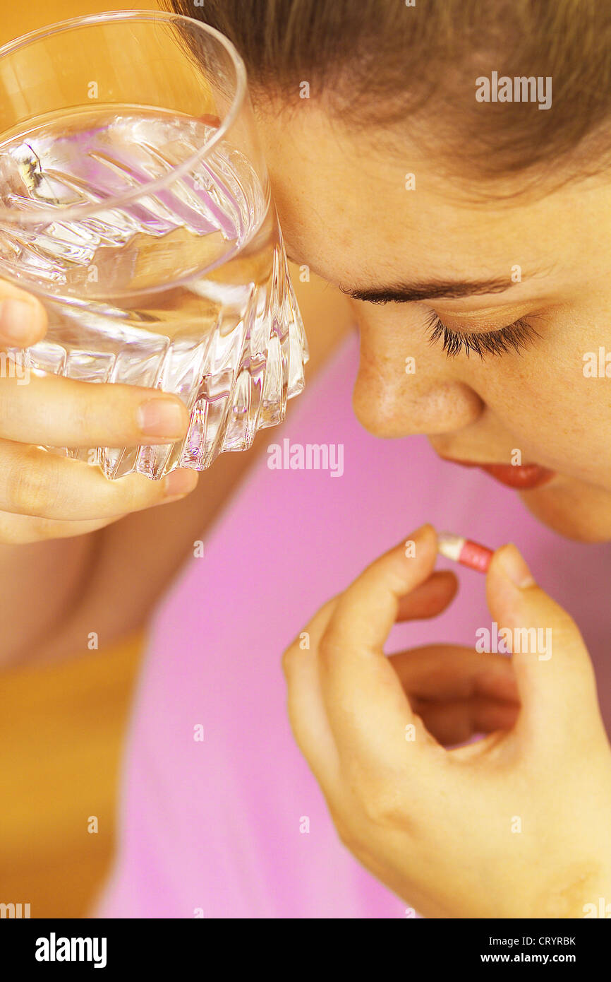 WOMAN TAKING MEDICATION Stock Photo - Alamy