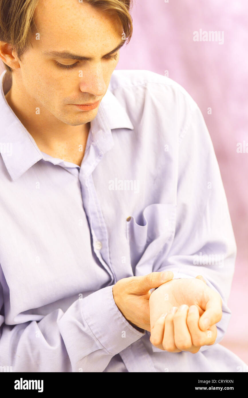 TAKING A MAN'S PULSE Stock Photo - Alamy