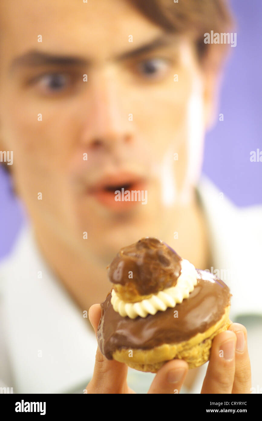 MAN EATING SWEETS Stock Photo - Alamy