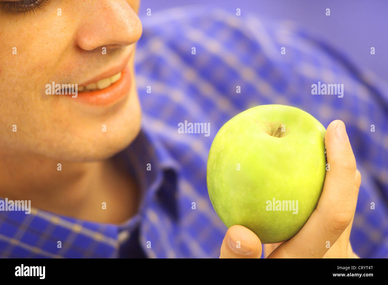 MAN EATING FRUIT Stock Photo - Alamy
