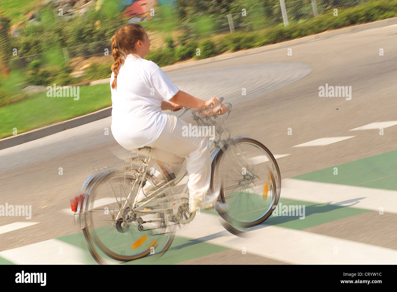 Overweight woman on bicycle hi-res stock photography and images - Alamy