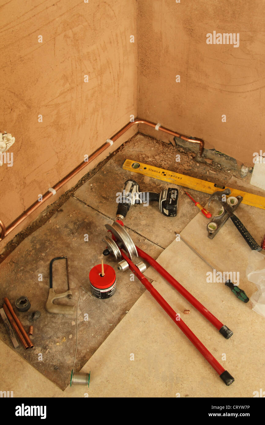 fitting a new copper pipe in kitchen for cold water tap Stock Photo - Alamy
