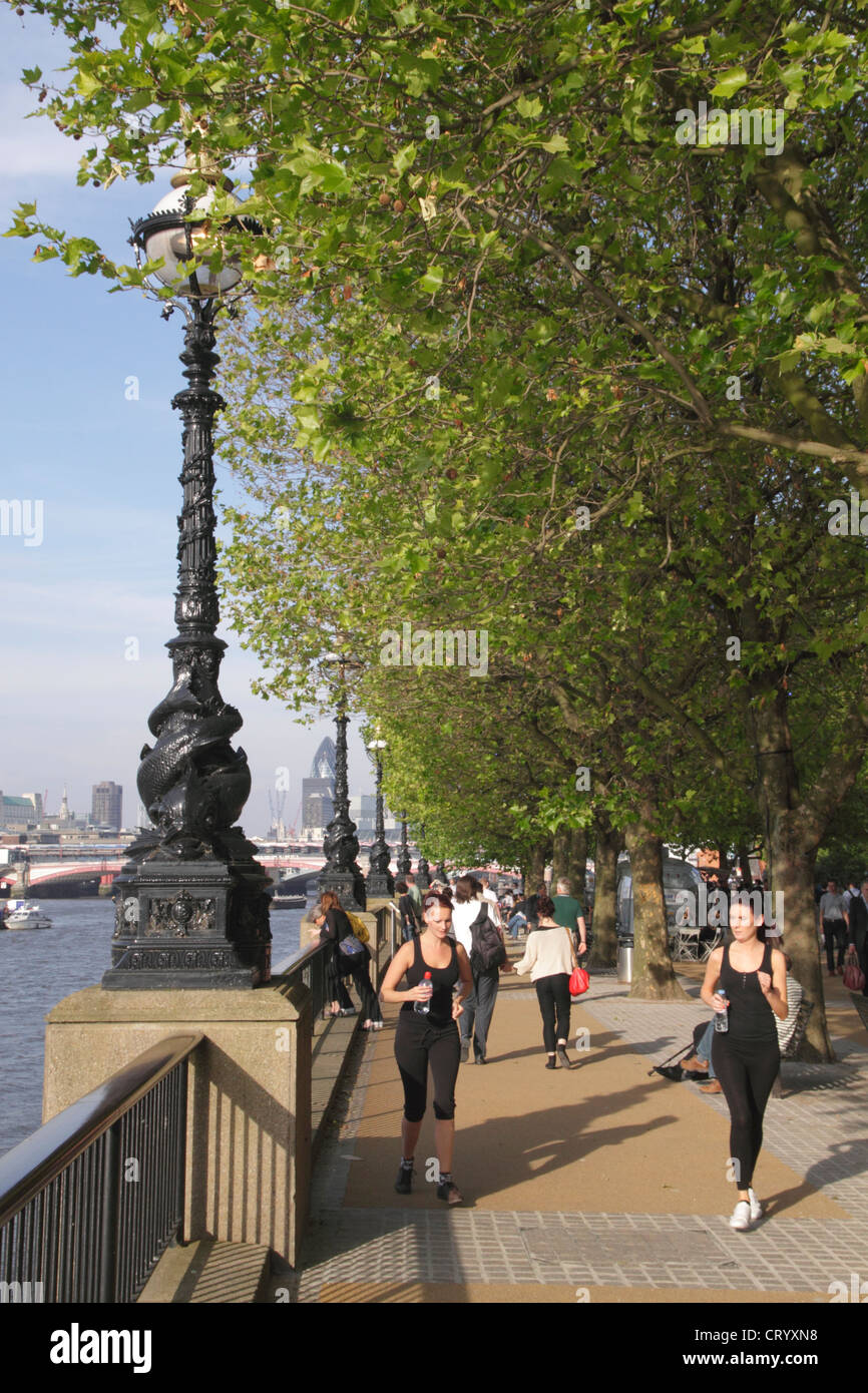 Jogging along the South Bank Promenade London 2 Stock Photo - Alamy