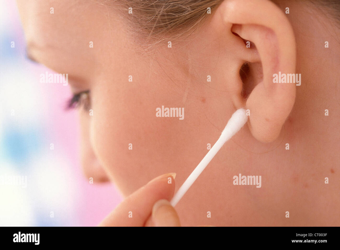WOMAN CLEANING EARS Stock Photo - Alamy