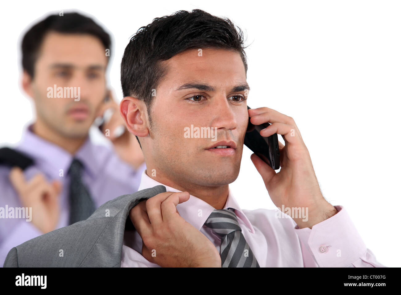 businessmen talking on their cell phone Stock Photo - Alamy