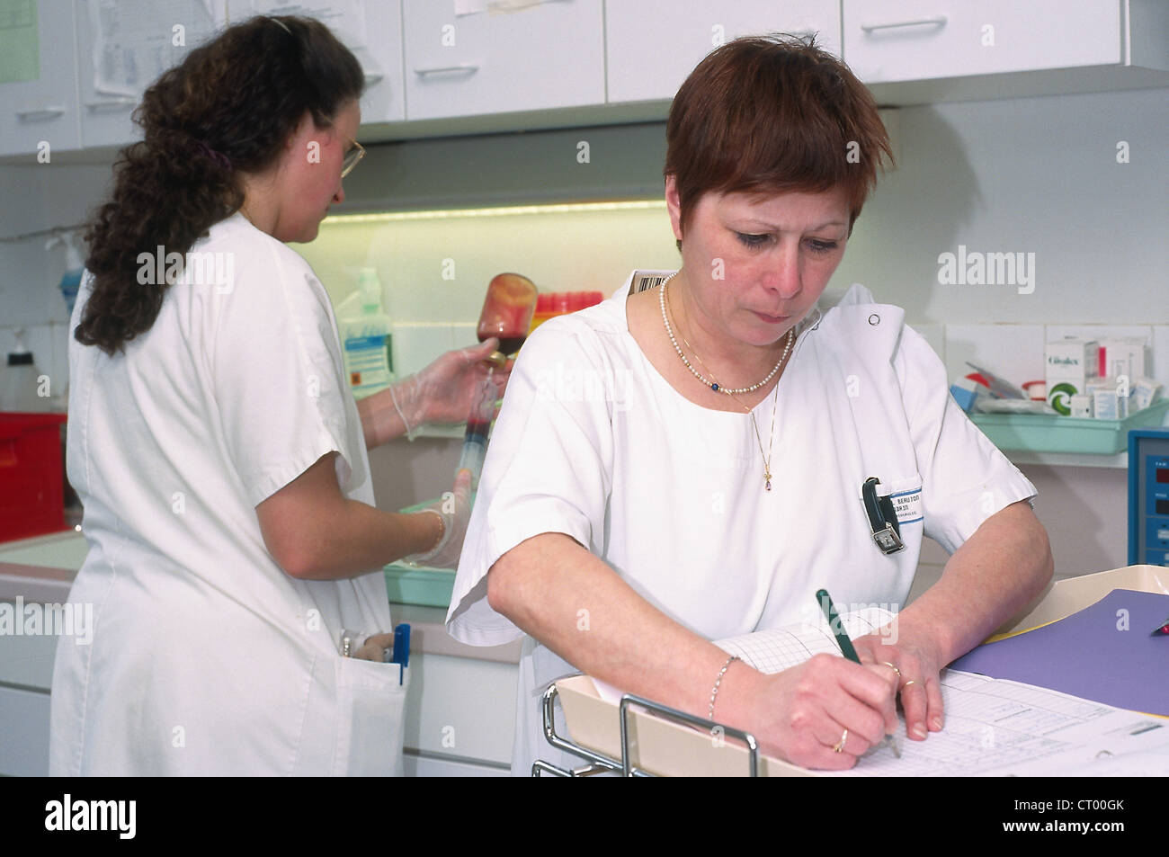 NURSE WITH PATIENT'S RECORD Stock Photo - Alamy