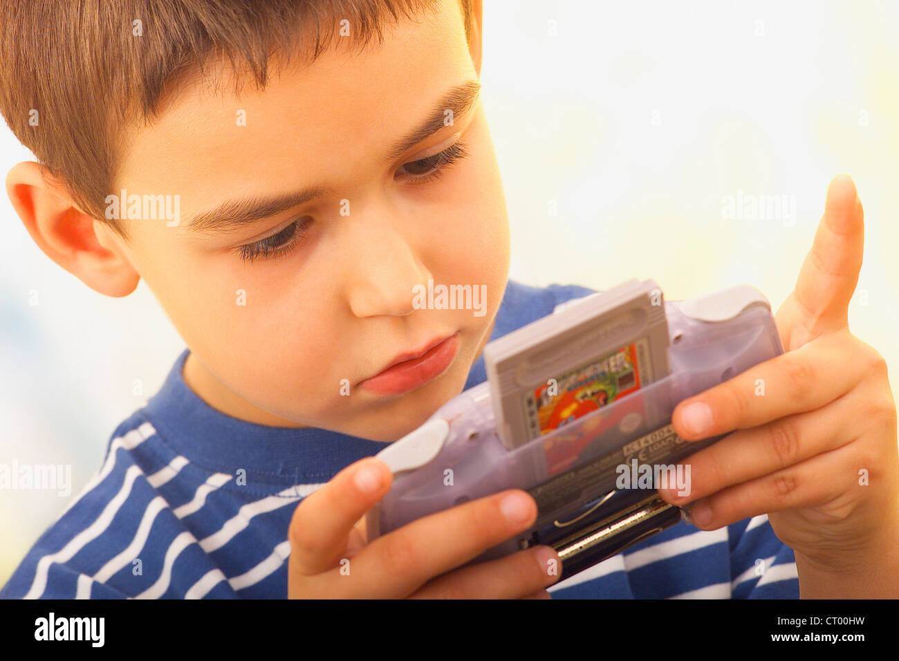 CHILD PLAYING WITH VIDEO GAME Stock Photo - Alamy