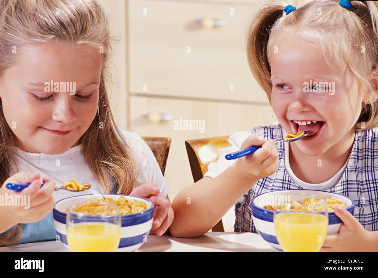 CHILD EATING BREAKFAST Stock Photo - Alamy