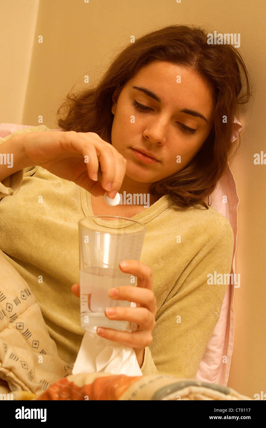 WOMAN WITH ASPIRIN Stock Photo - Alamy