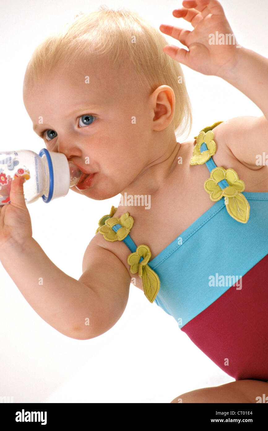 CHILD WITH BABY BOTTLE Stock Photo - Alamy