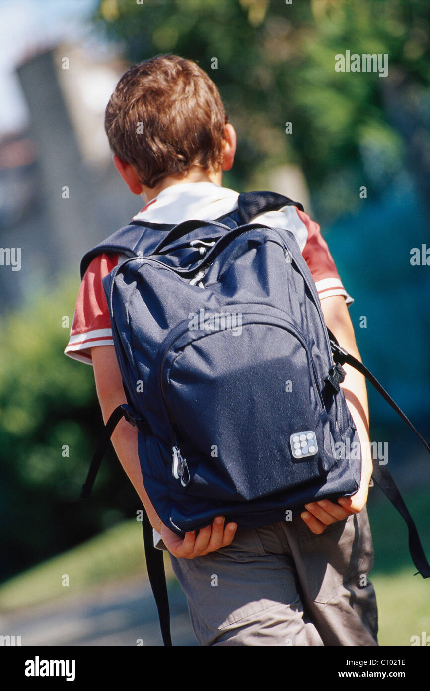 Schoolchild with heavy schoolbag hi-res stock photography and images ...