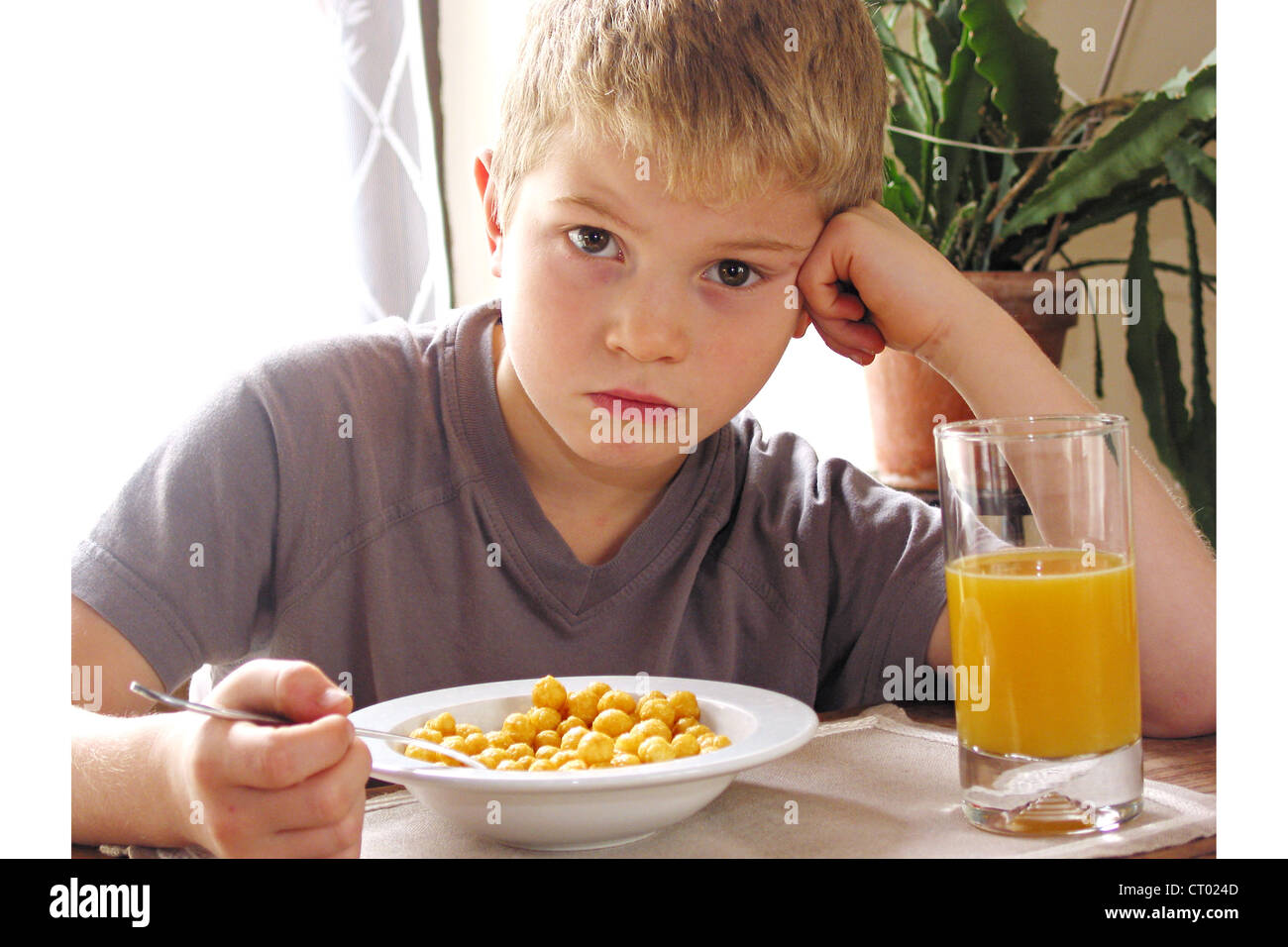 Grumpy boy and dinner hi-res stock photography and images - Alamy