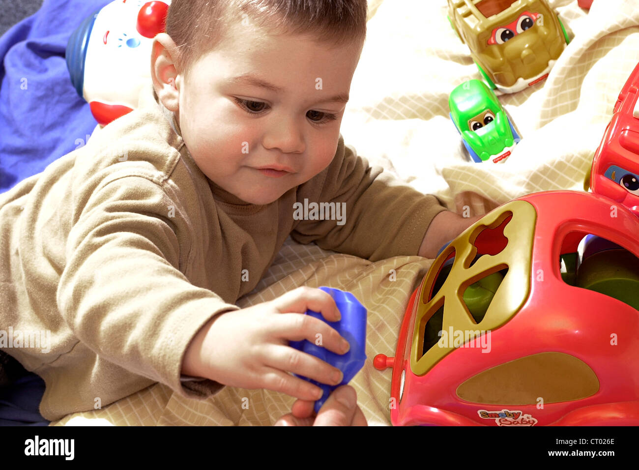 INFANT PLAYING INDOORS Stock Photo - Alamy