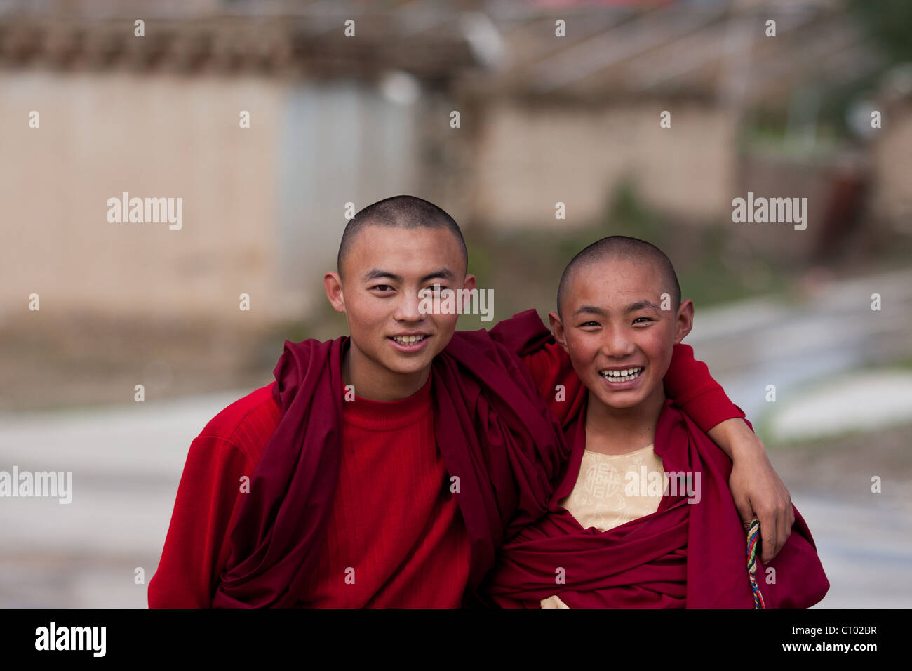 Two young chinese monks eager to pose for camera in Ganzi, Sichuan ...