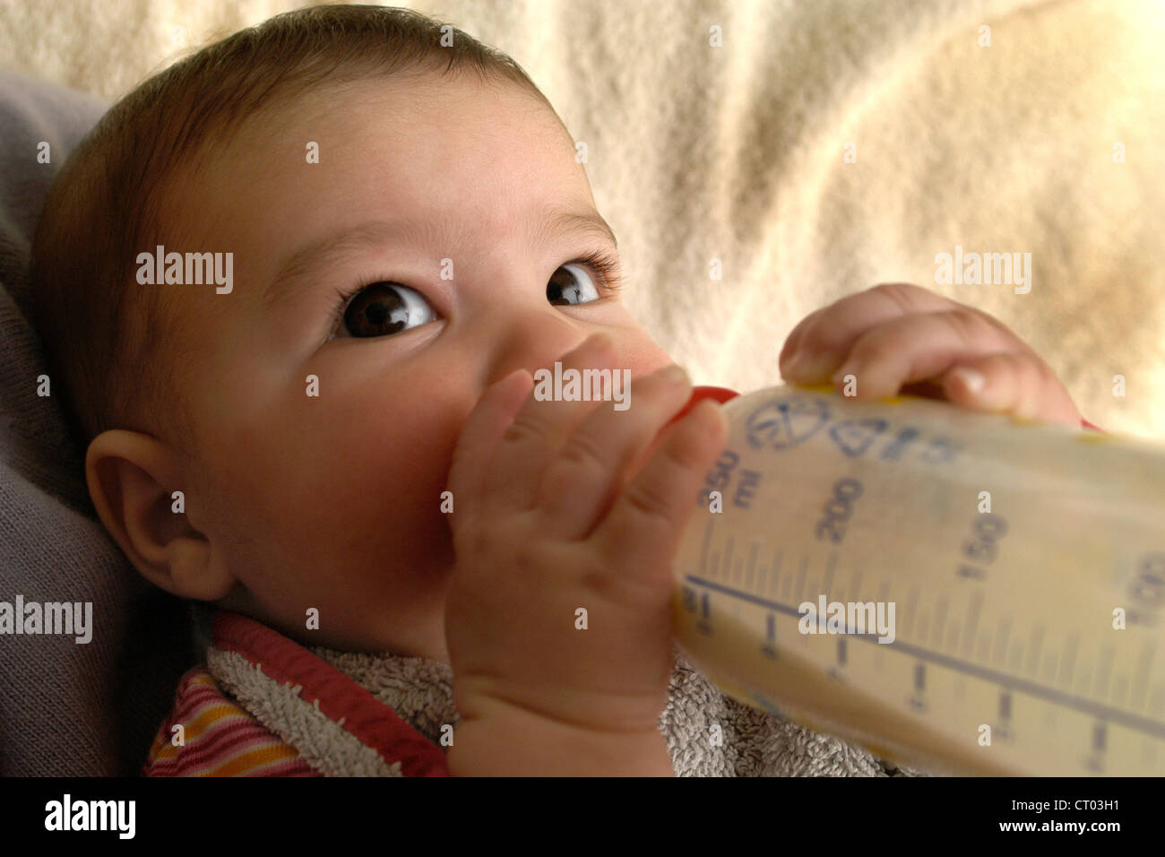 INFANT DRINKING FROM BABY BOTTLE Stock Photo - Alamy