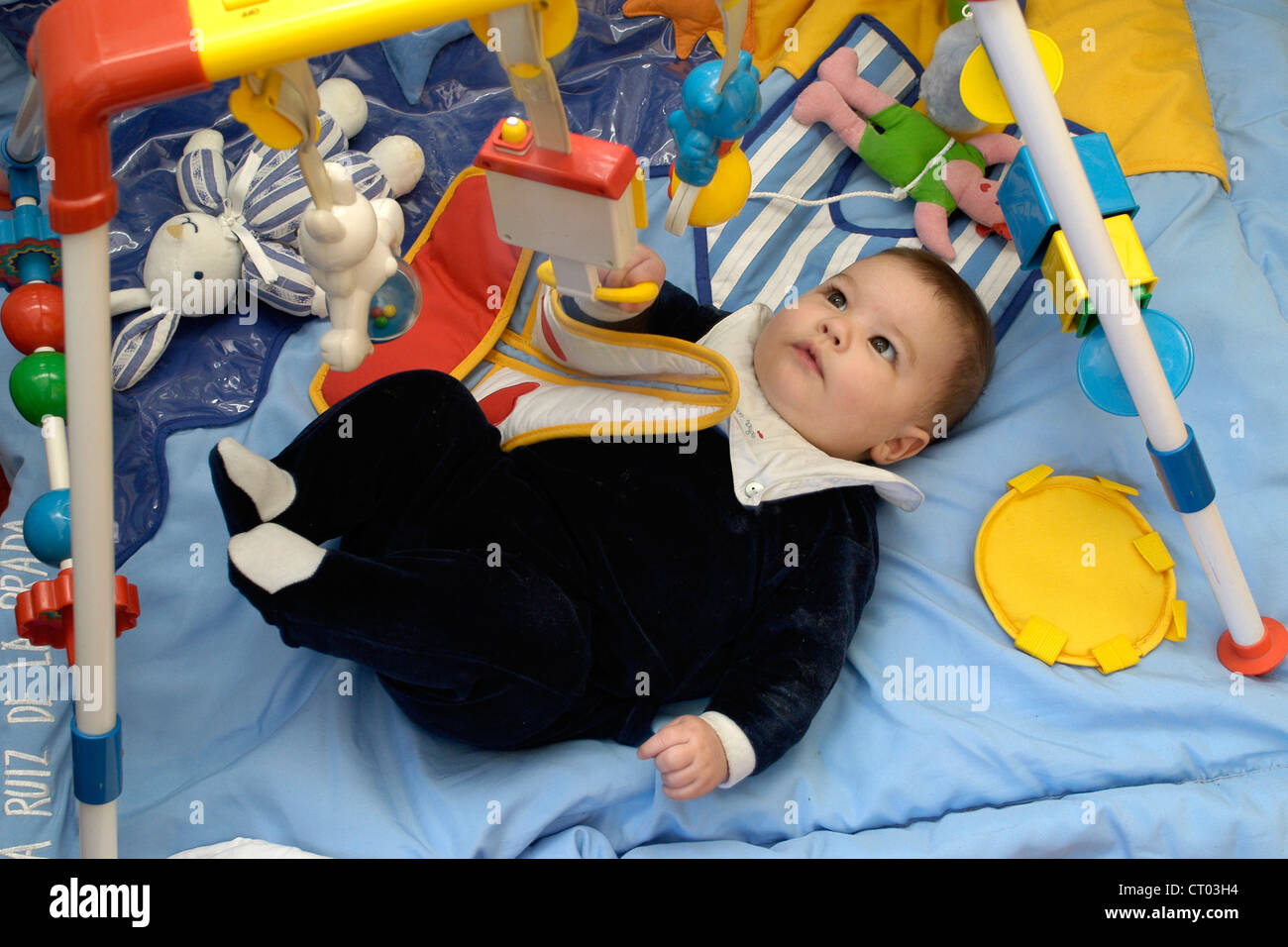 INFANT PLAYING INDOORS Stock Photo - Alamy