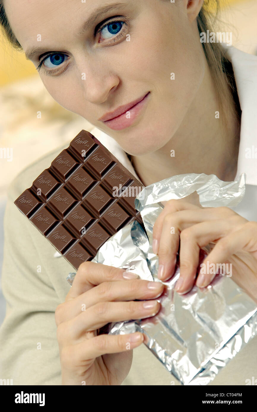 WOMAN EATING SWEETS Stock Photo - Alamy