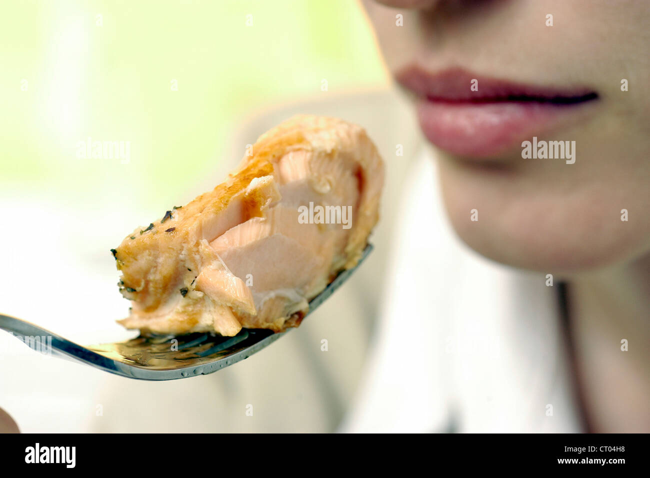 WOMAN EATING FISH Stock Photo - Alamy
