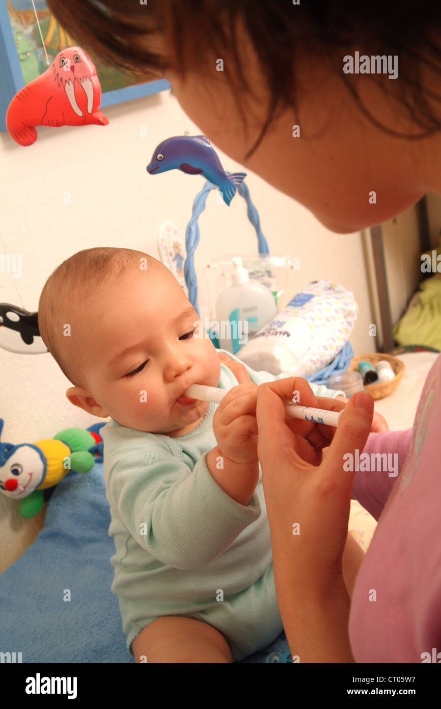 INFANT TAKING MEDICATION Stock Photo - Alamy