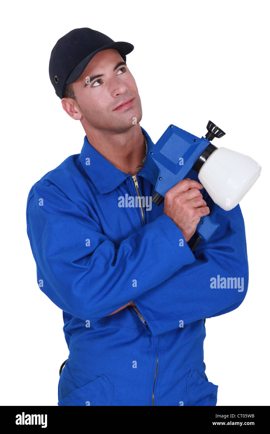 workman in jumpsuit looking upwards Stock Photo - Alamy
