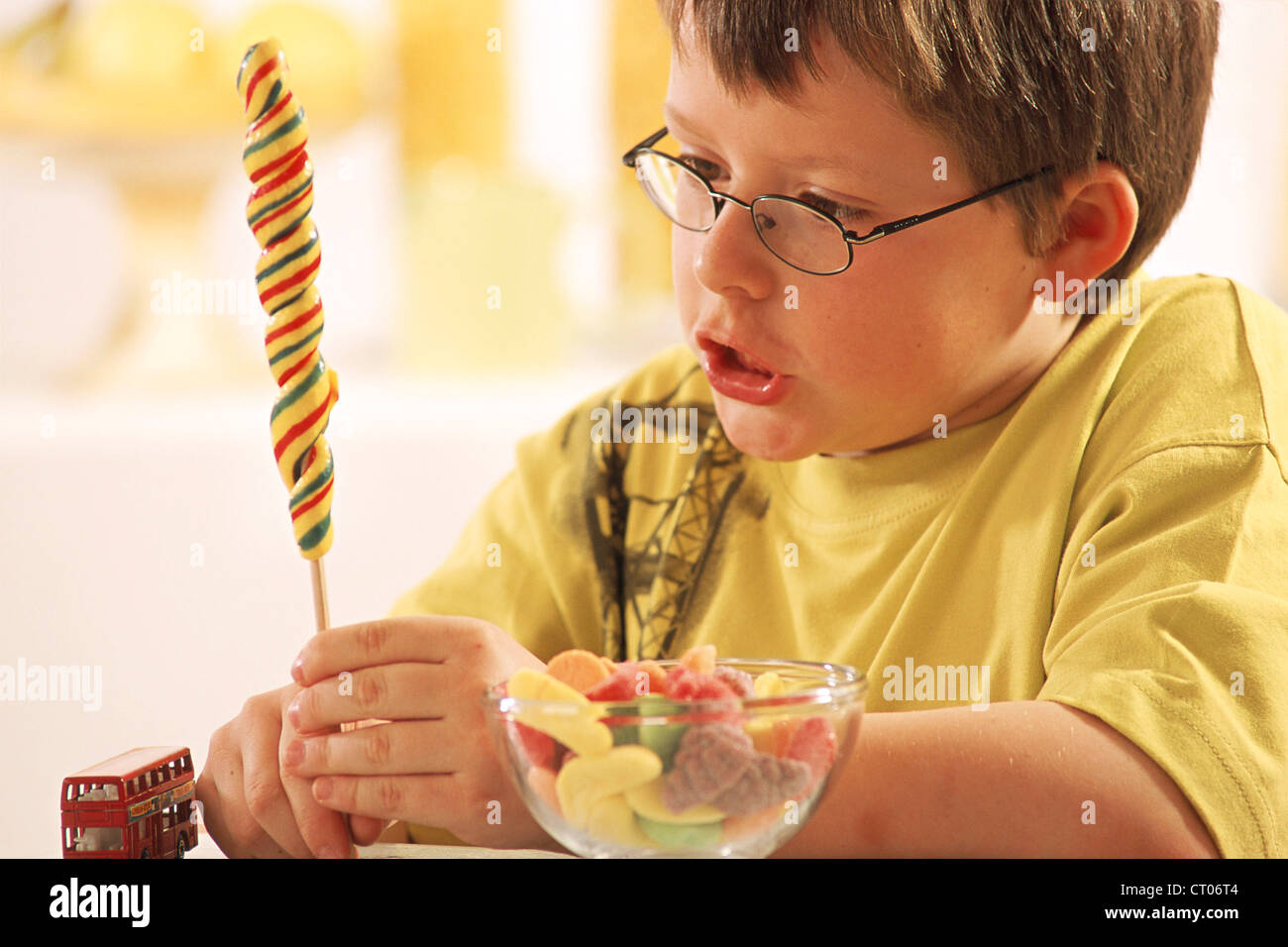 CHILD EATING SWEETS Stock Photo - Alamy