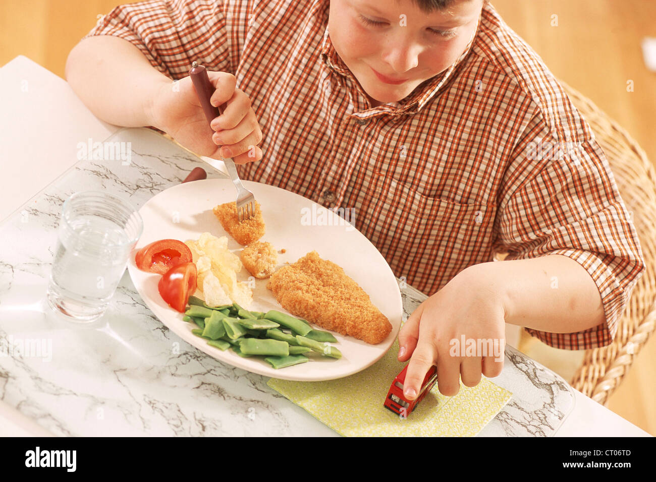 CHILD EATING FISH Stock Photo - Alamy