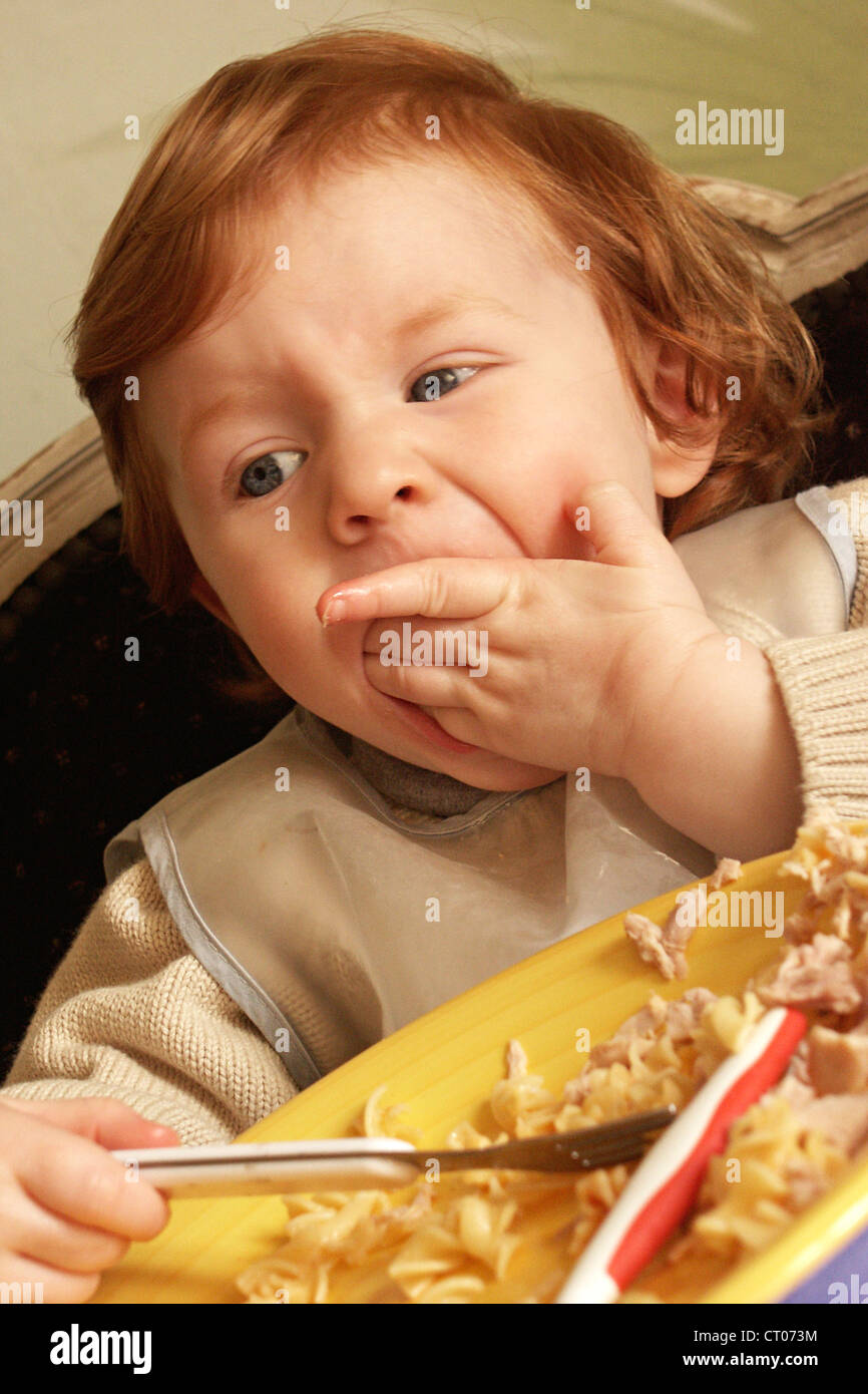 Girl eating food with a bib hi-res stock photography and images - Alamy