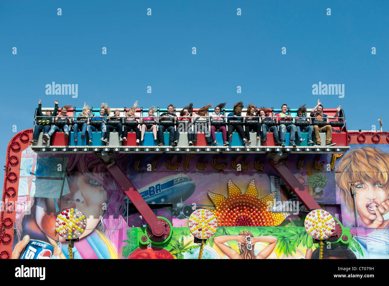 The 'Miami Trip' fairground ride in action Stock Photo - Alamy