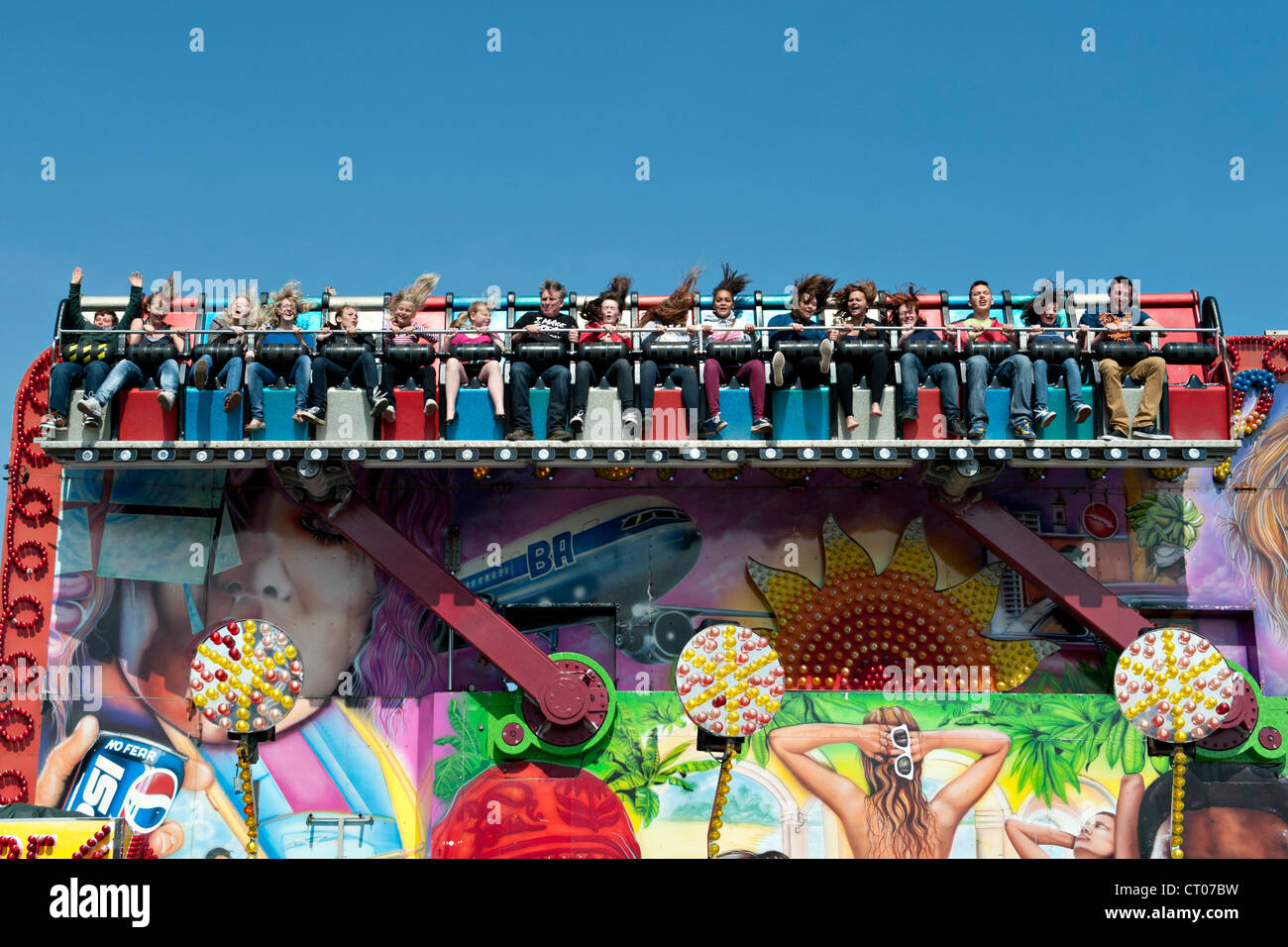 The 'Miami Trip' fairground ride in action Stock Photo - Alamy
