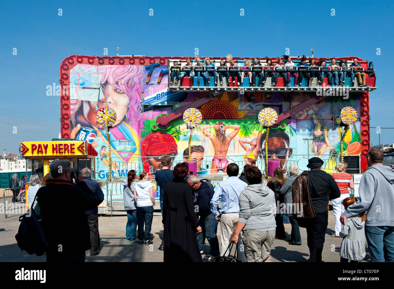 The 'Miami Trip' fairground ride in action Stock Photo - Alamy