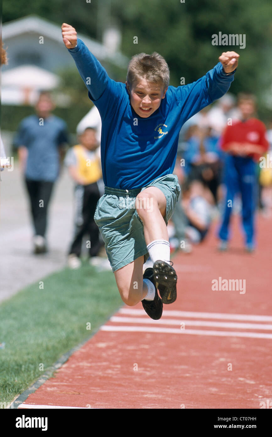 CHILD PLAYING A SPORT Stock Photo - Alamy
