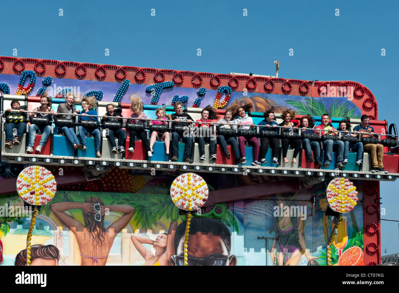 The 'Miami Trip' fairground ride in action Stock Photo - Alamy