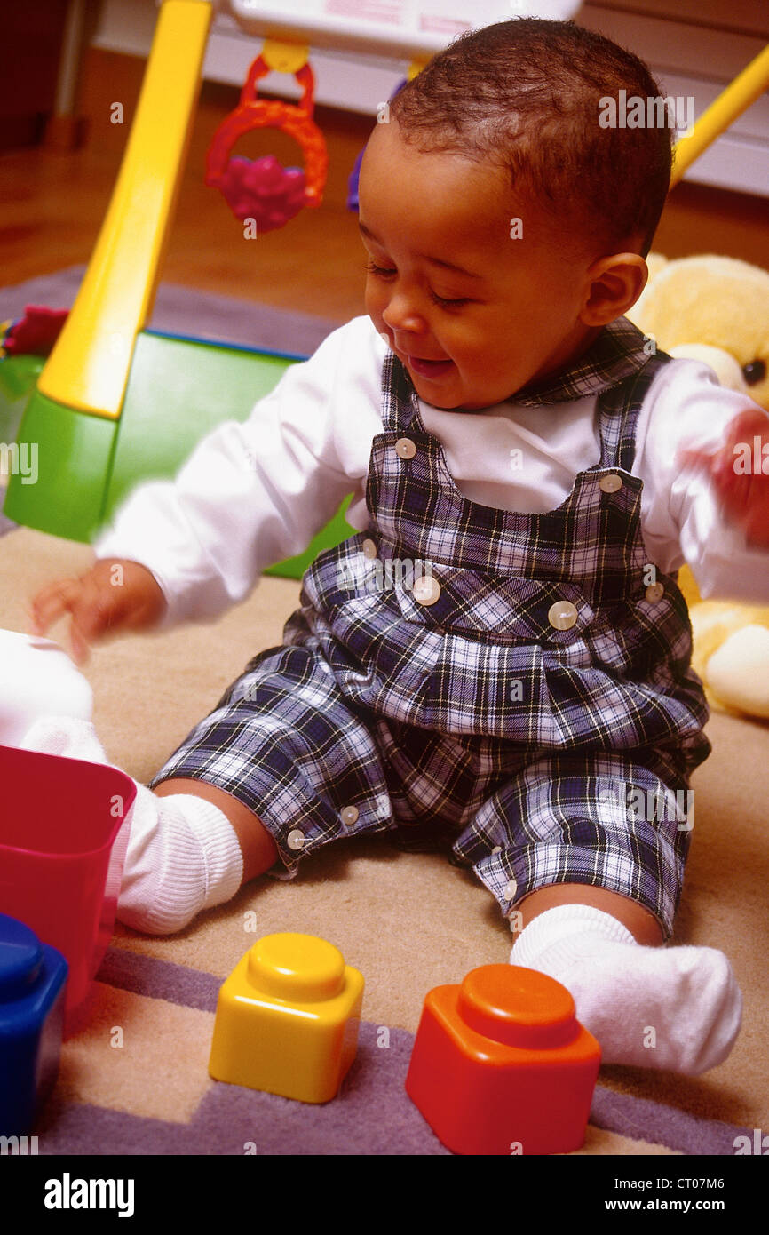 INFANT PLAYING INDOORS Stock Photo - Alamy