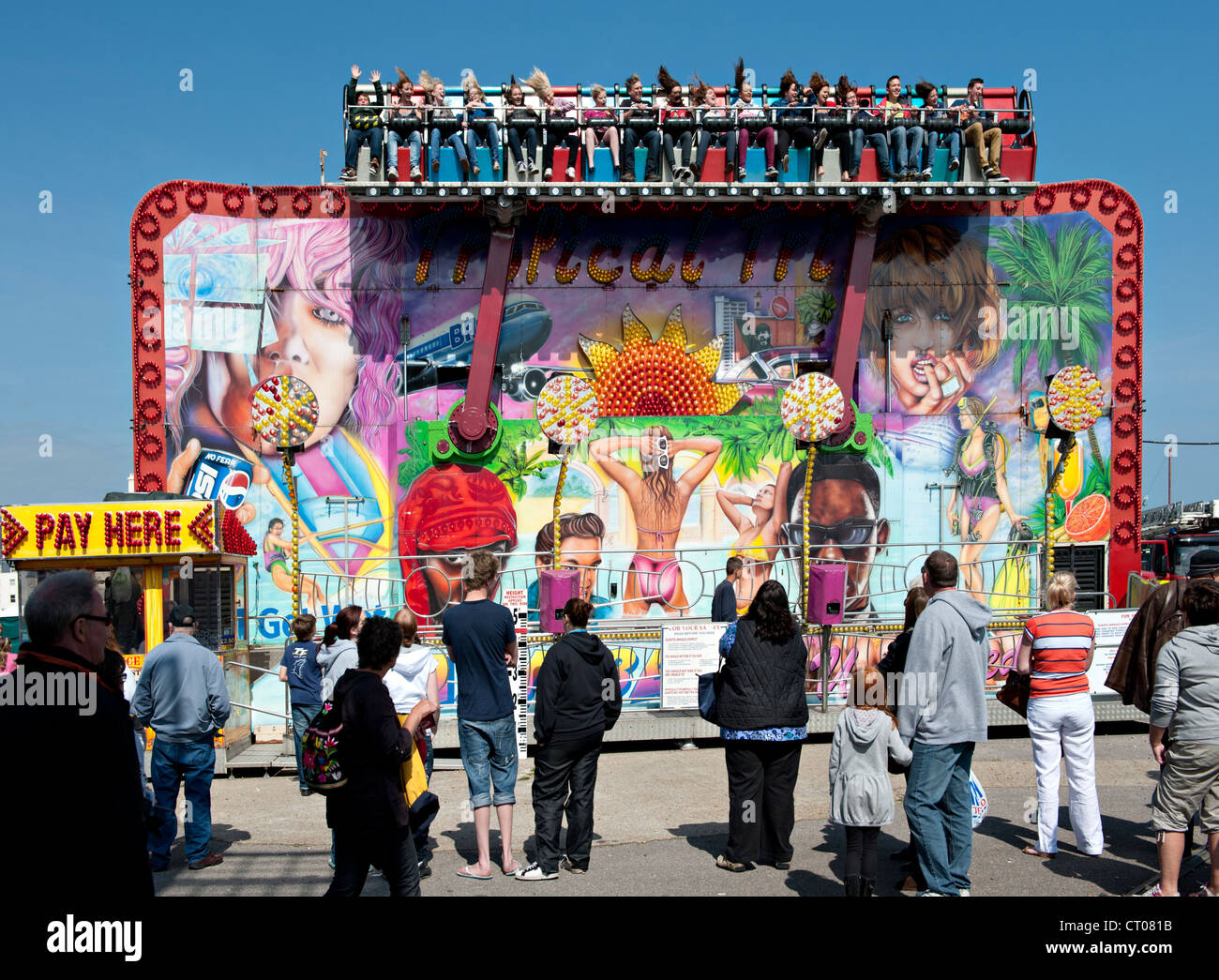 The 'Miami Trip' fairground ride in action Stock Photo - Alamy