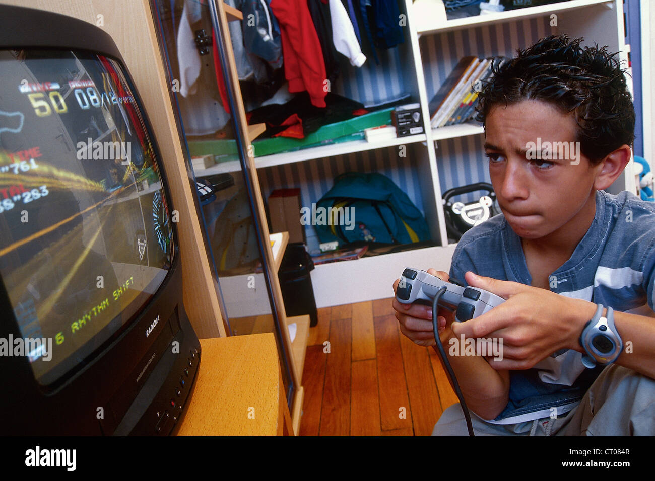 CHILD PLAYING WITH VIDEO GAME Stock Photo - Alamy