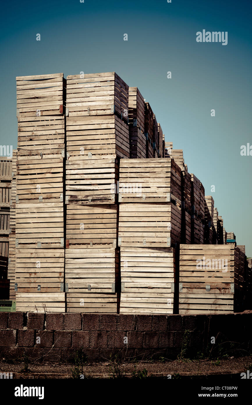 Grunge Crates stack. weathered wooden boxes in tall rows. toned and ...