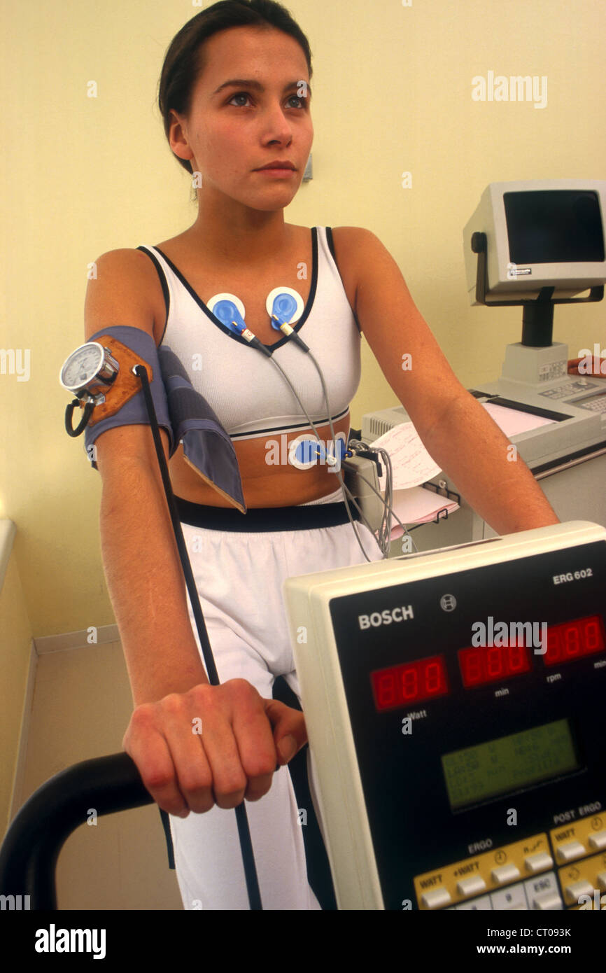 Woman undergoing electrocardiography ekg examination hi-res stock ...