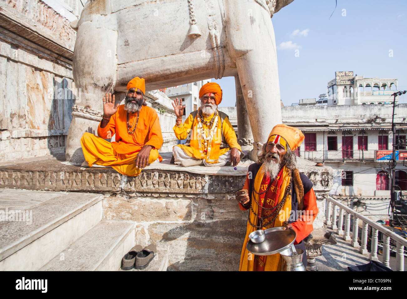 Three Sadhus, Indian Hindu holy men dressed in traditional saffron ...