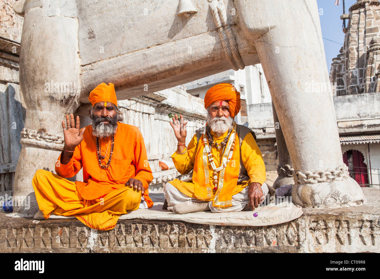 Two Sadhus, Indian Hindu holy men dressed in traditional saffron robes ...
