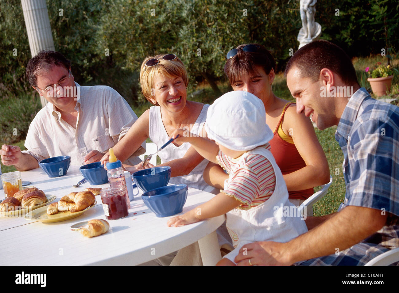 Mature woman eating breakfast outdoor hi-res stock photography and ...