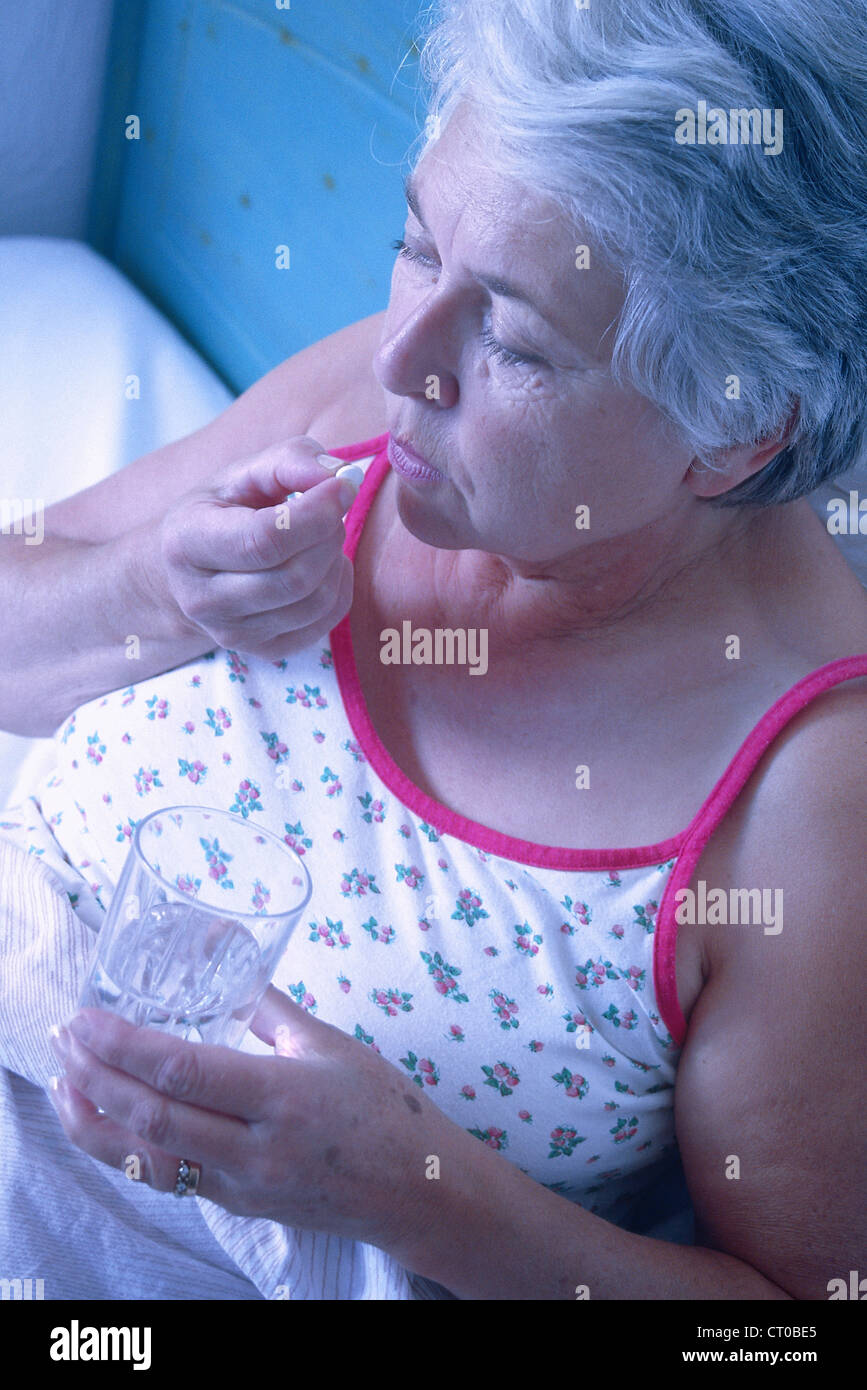 ELDERLY PERSON TAKING MEDICATION Stock Photo - Alamy