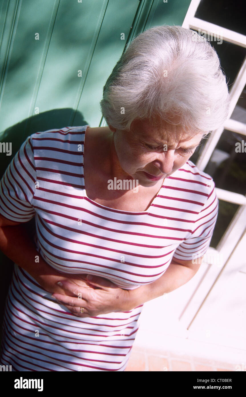 STOMACH PAIN IN AN ELDERLY PERS Stock Photo - Alamy
