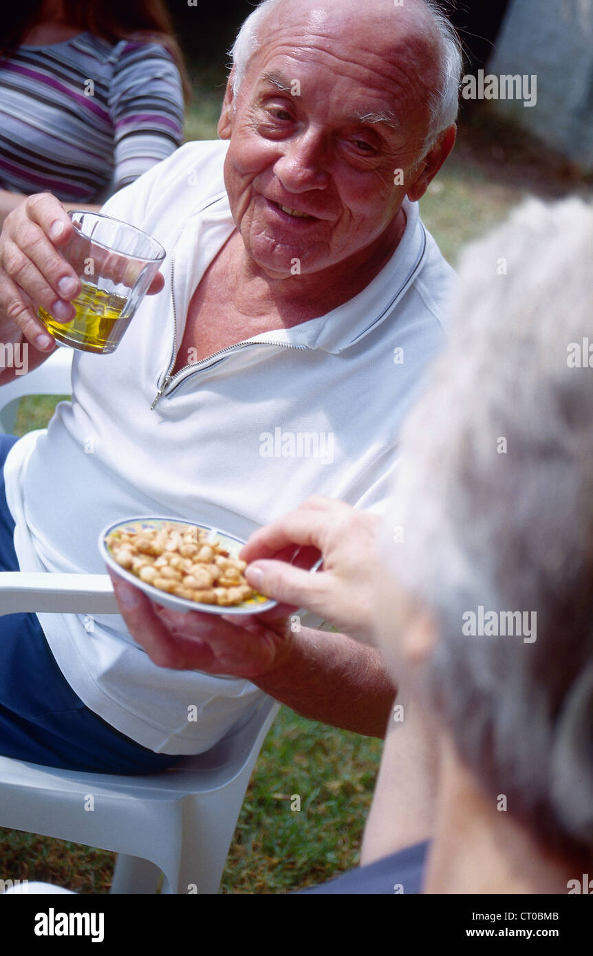 ELDERLY PERSON SNACKING Stock Photo - Alamy