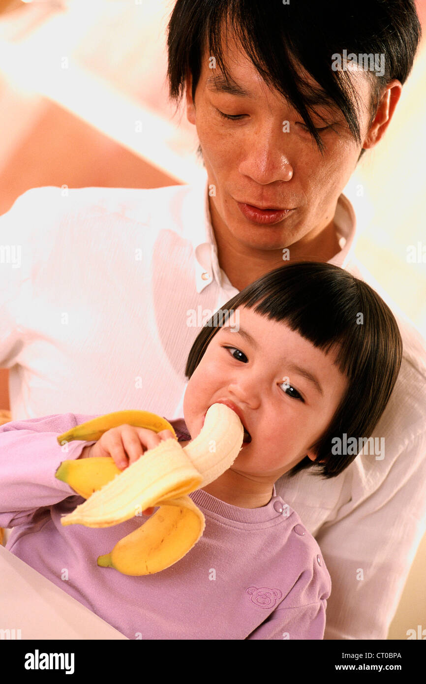 CHILD EATING FRUIT Stock Photo - Alamy