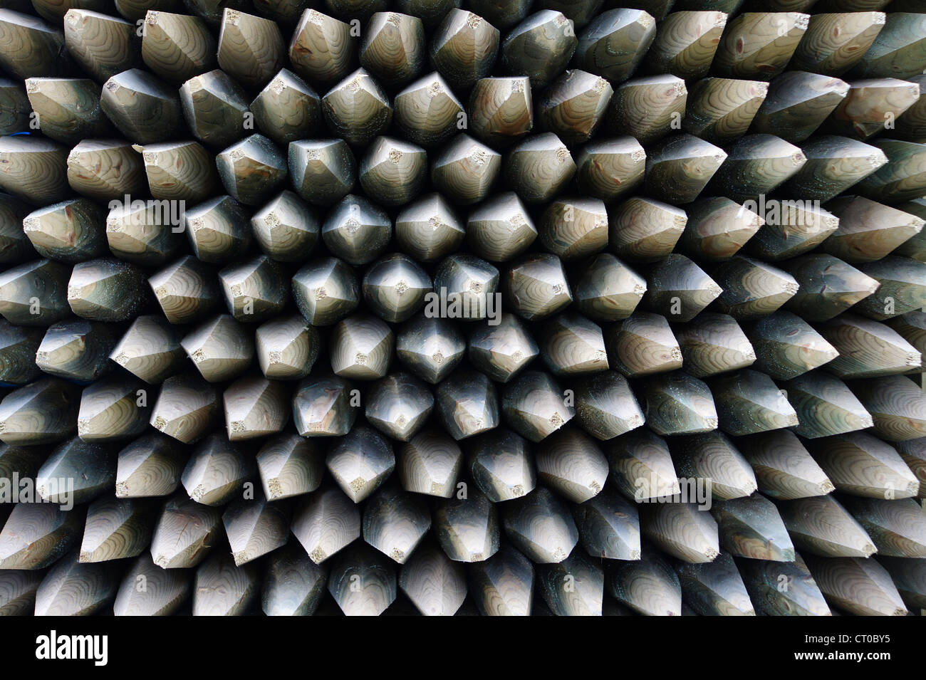 Wooden stakes are pointed and tightly packed in a stack Stock Photo - Alamy