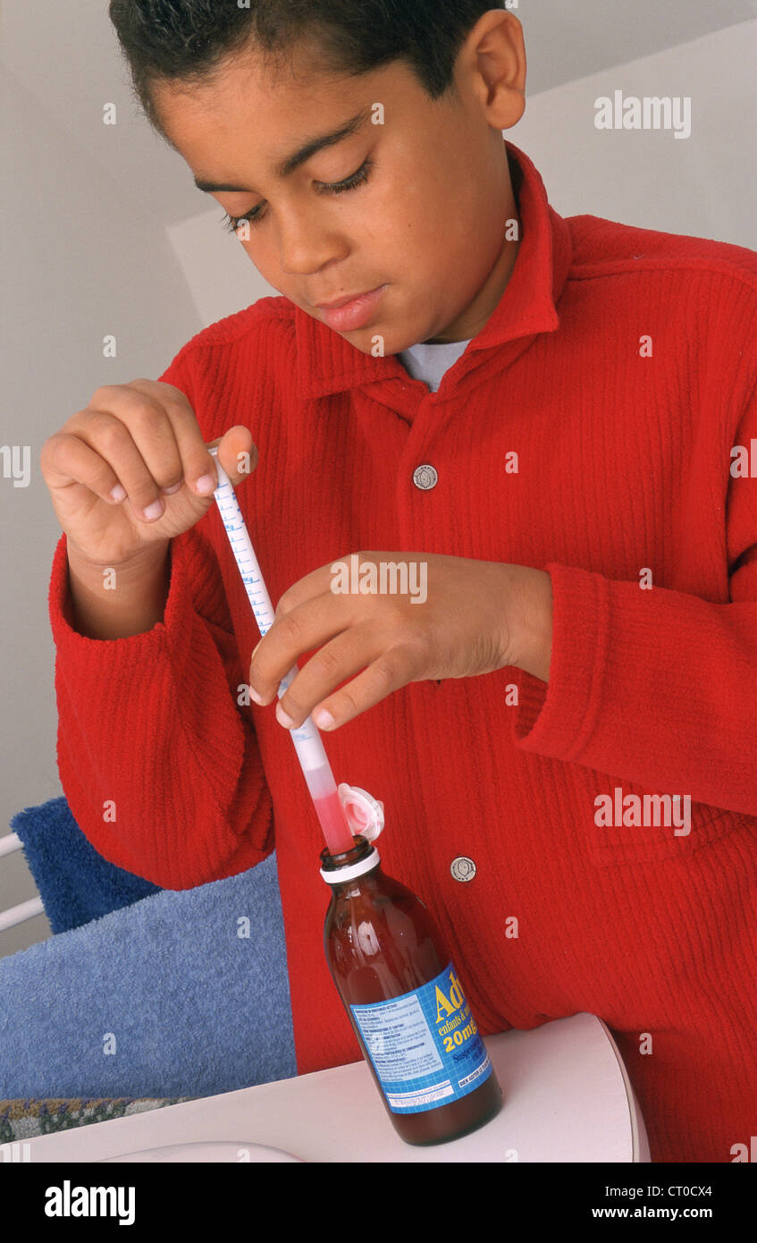 CHILD TAKING MEDICATION Stock Photo - Alamy