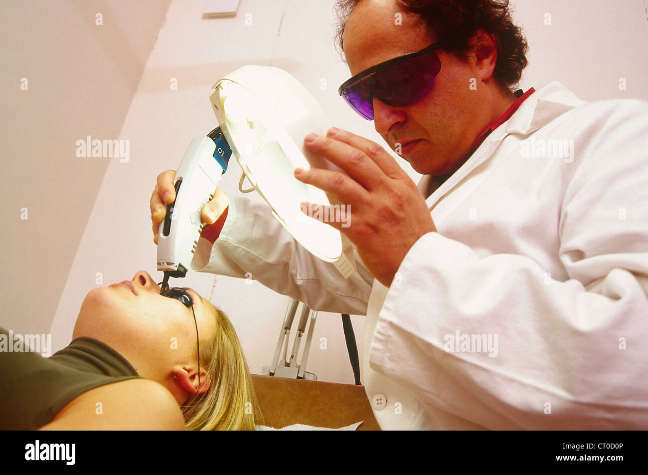 DERMATOLOGY, TREATING A WOMAN Stock Photo - Alamy